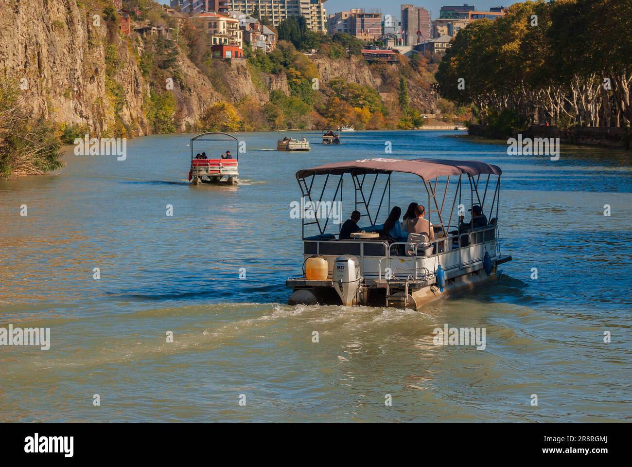Georgia, Tbilisi - October 30, 2022: Tourists ride on a pleasure boat ...