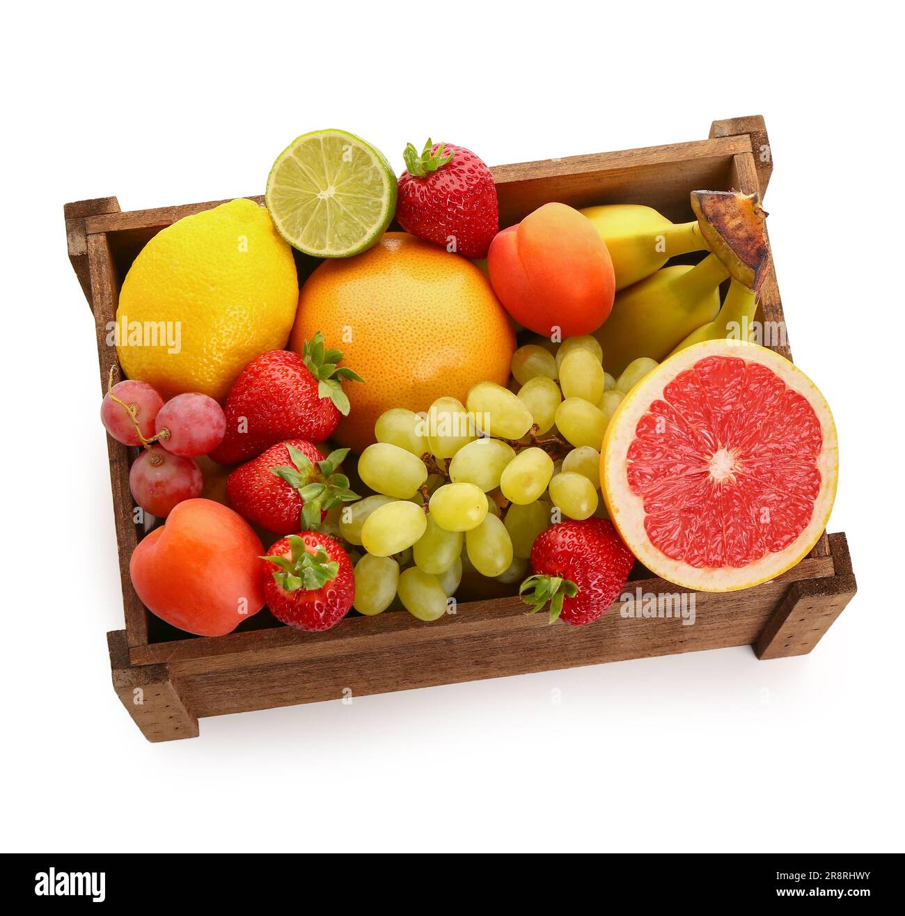Wooden box with different fresh fruits on white background Stock Photo ...