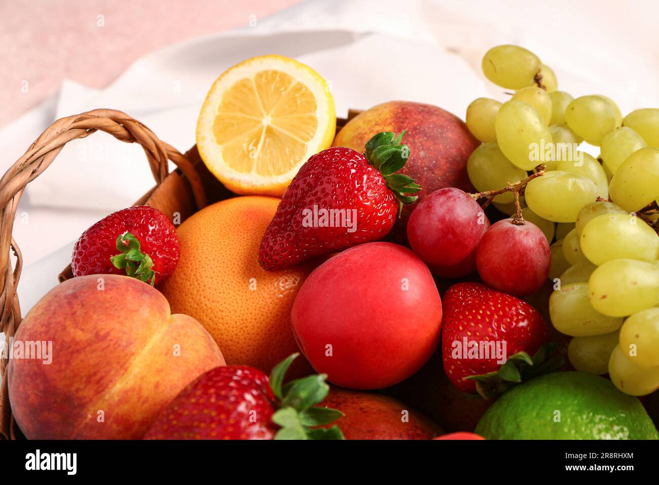 Wicker basket with different fresh fruits, closeup Stock Photo - Alamy