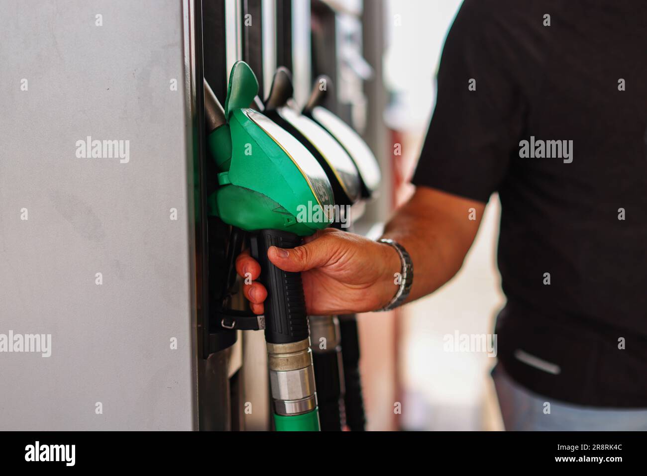 choosing type of gasoline, driver on urban petrol station Stock Photo ...