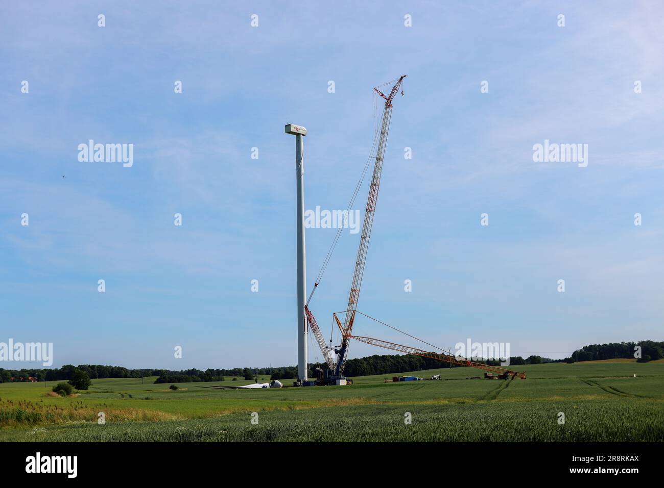 People constructing a wind mill Stock Photo - Alamy