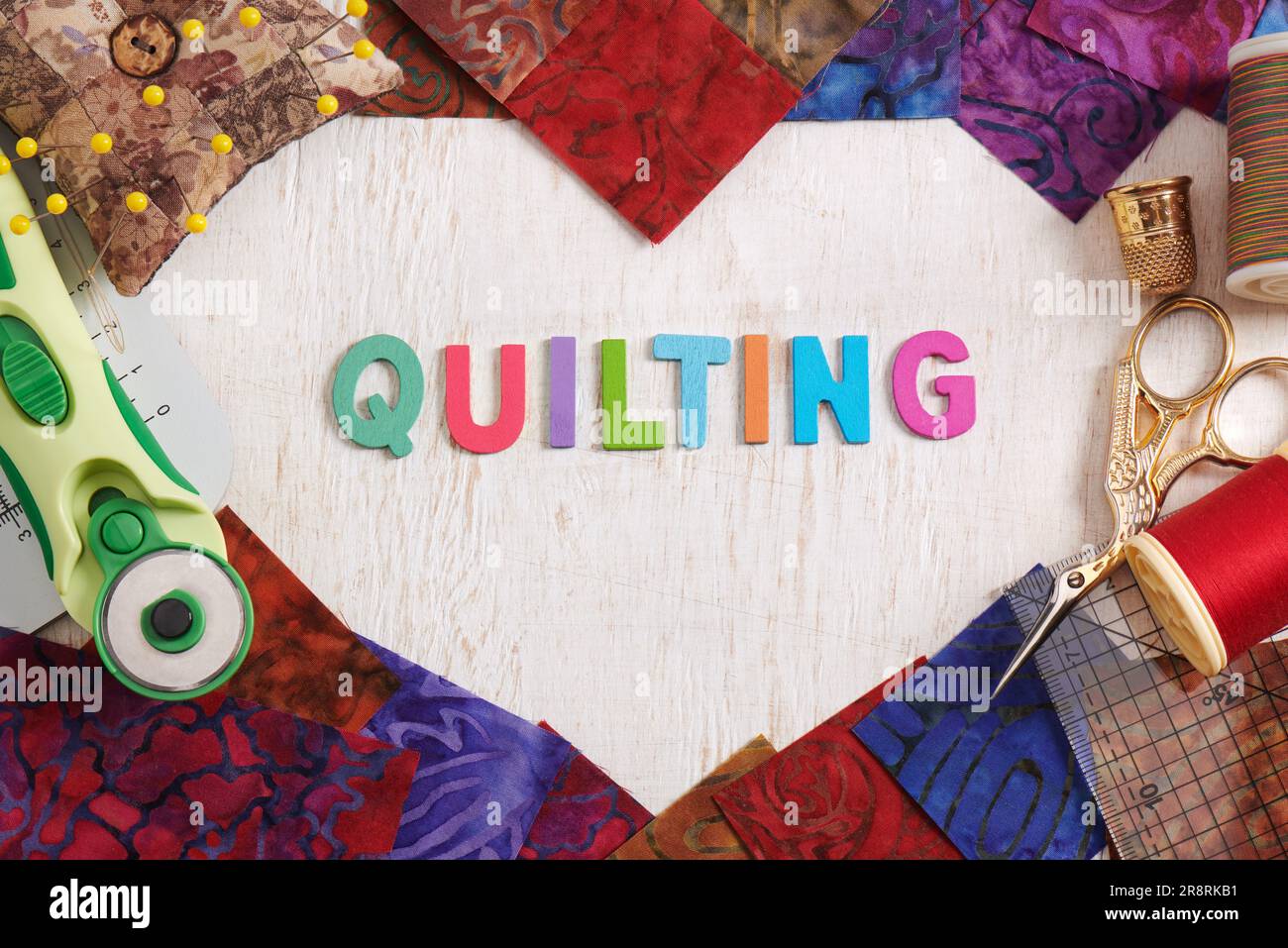 Wooden letters, consisting to the word quilting surrounded by ...