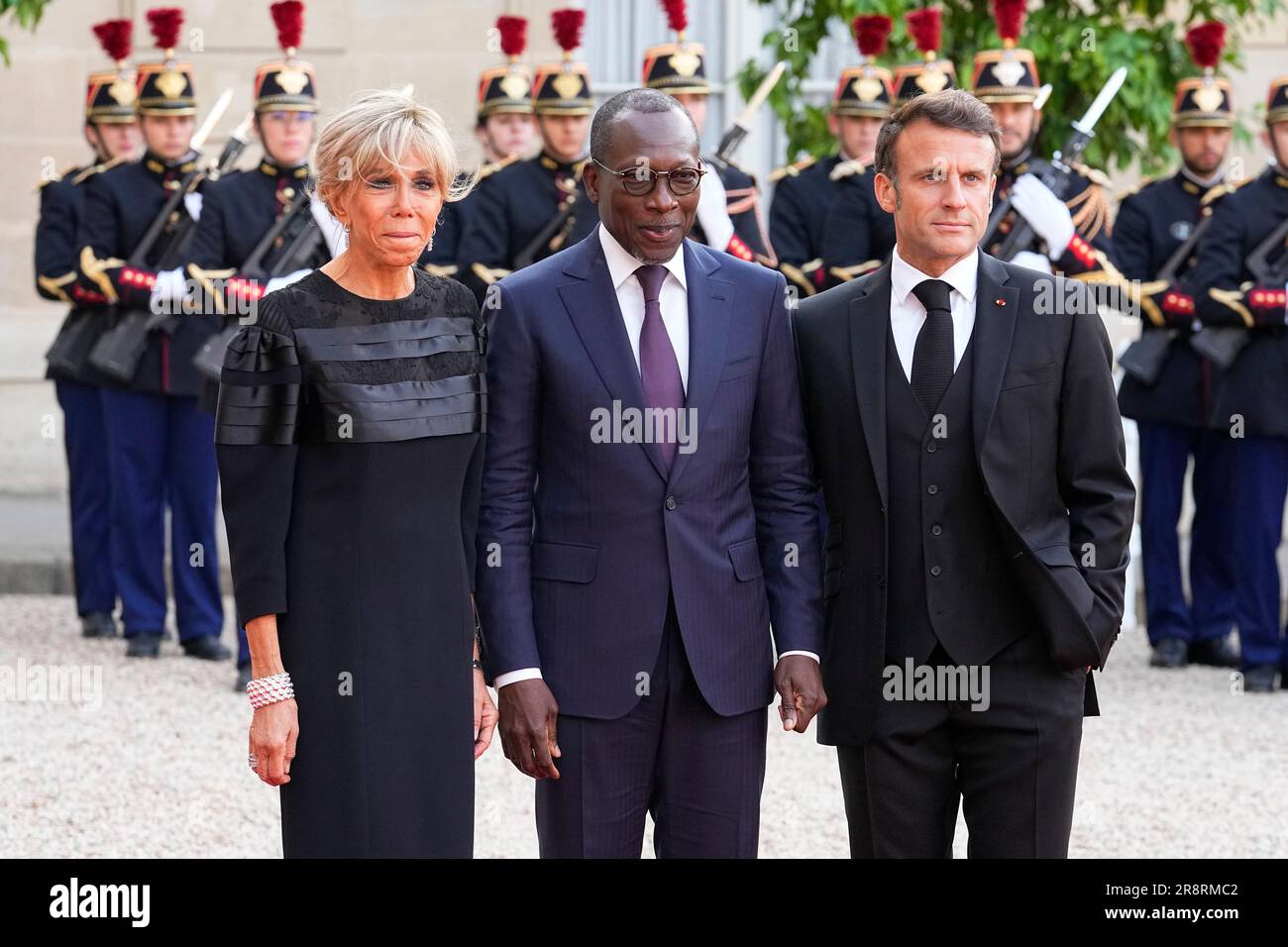 French President Emmanuel Macron and his wife Brigitte Macron welcome ...