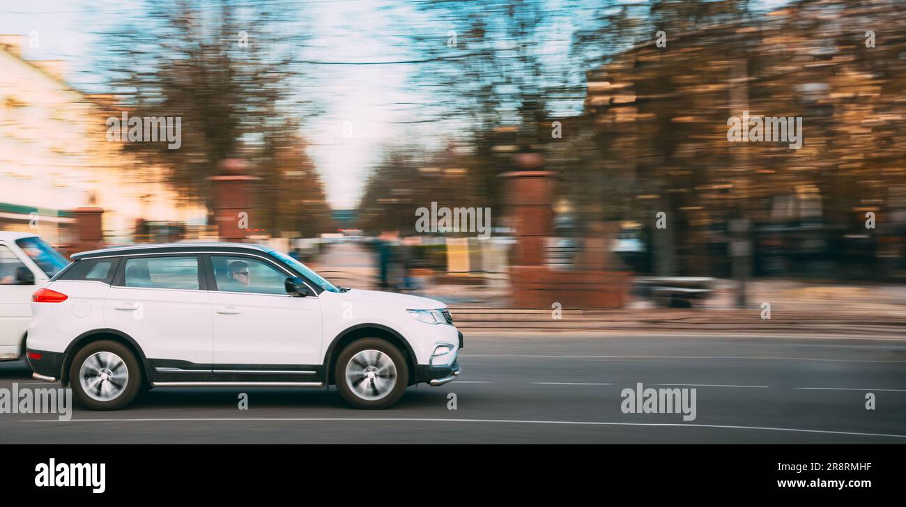 White Geely Boyue (Geely Atlas) Car Fast Rides City Street. Side View ...