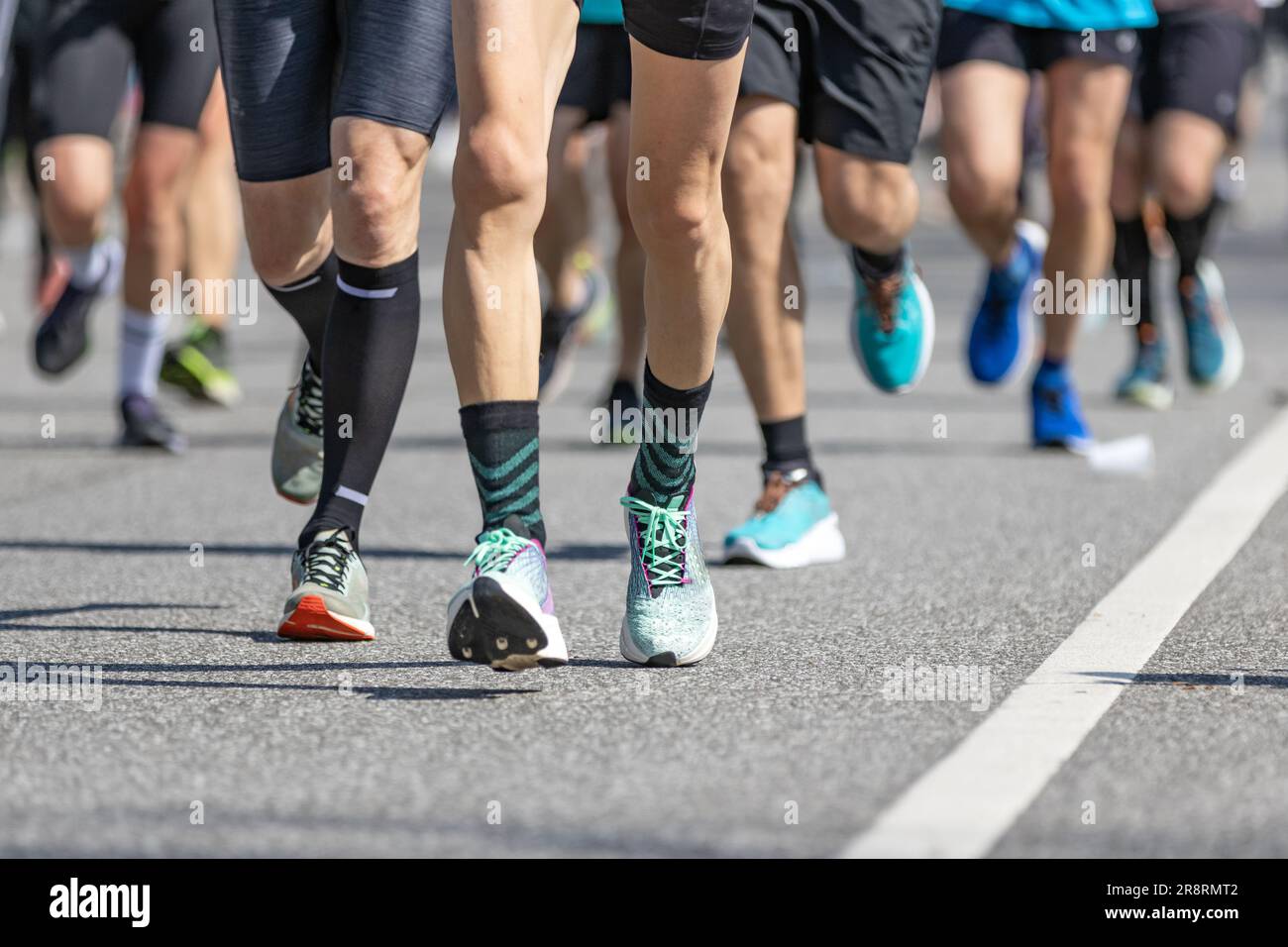 legs of a group of runners at the hamburg marathon Stock Photo - Alamy