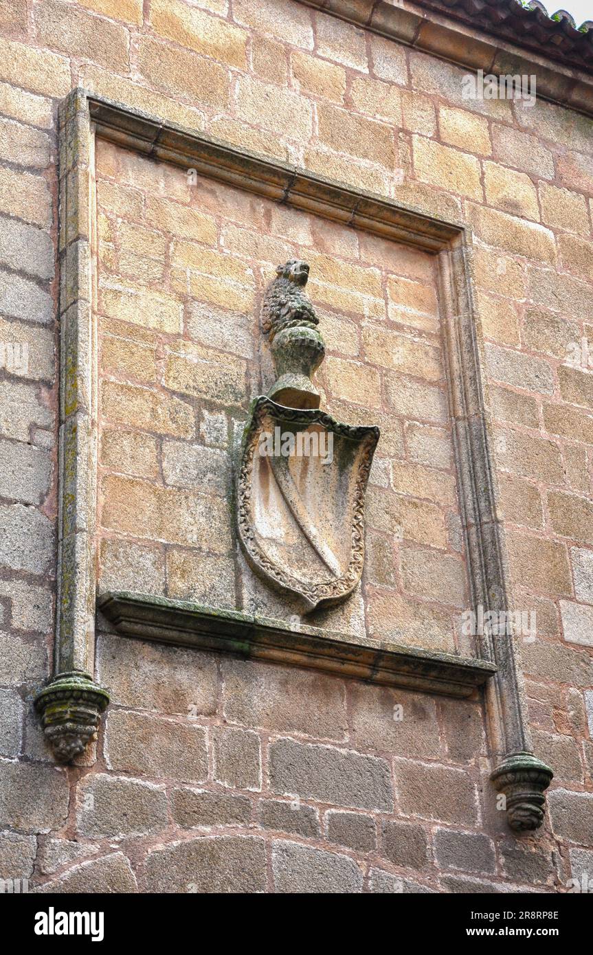 A traditional, Spanish coat of arms is depicted on an old heraldic ...