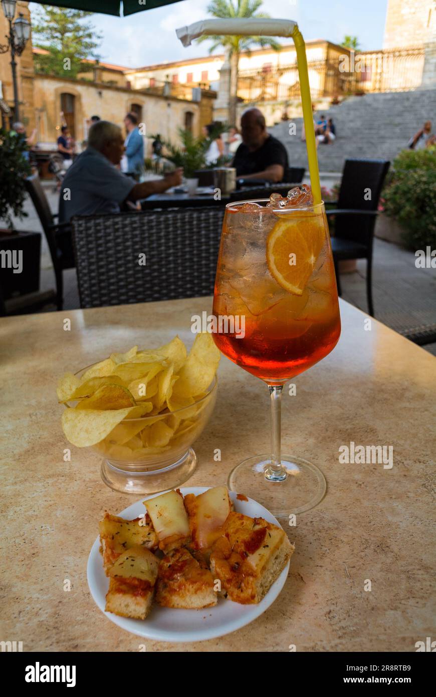 Cefalu, Sicily, Italy, An aerol spritz with snacks on a table Stock ...
