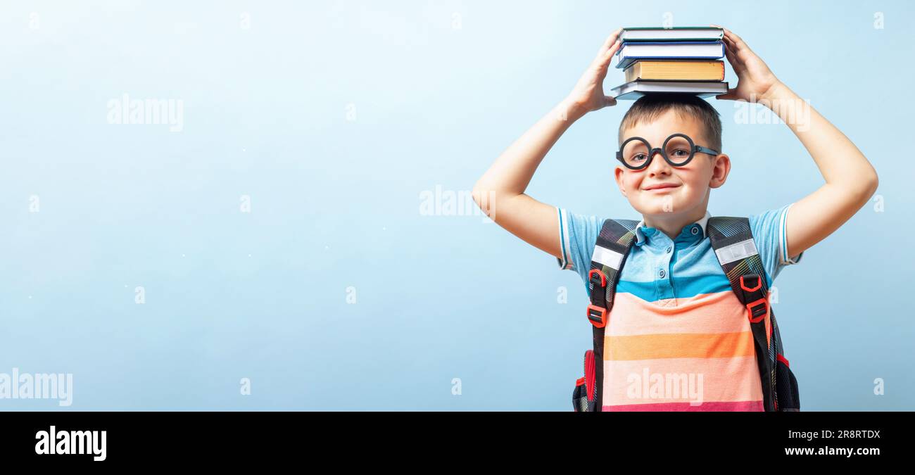 Portrait cheerful schoolkid holding hi-res stock photography and images ...