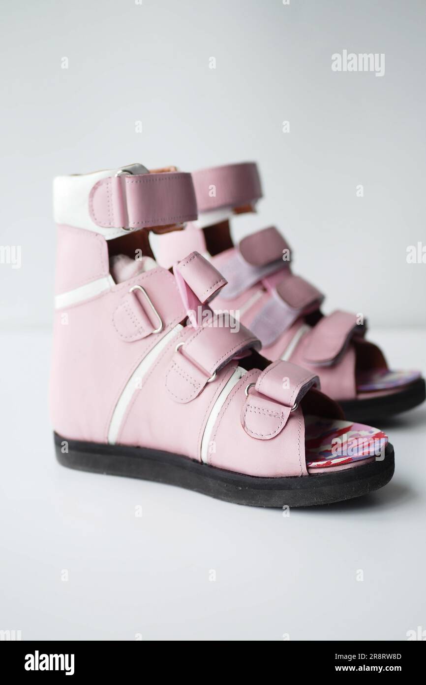 Child cerebral palsy disability, legs orthosis Stock Photo - Alamy