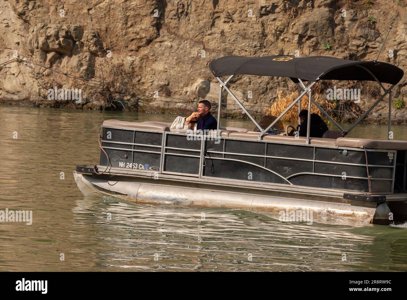 Georgia, Tbilisi - March 17, 2021: Tourists ride on a pleasure boat ...