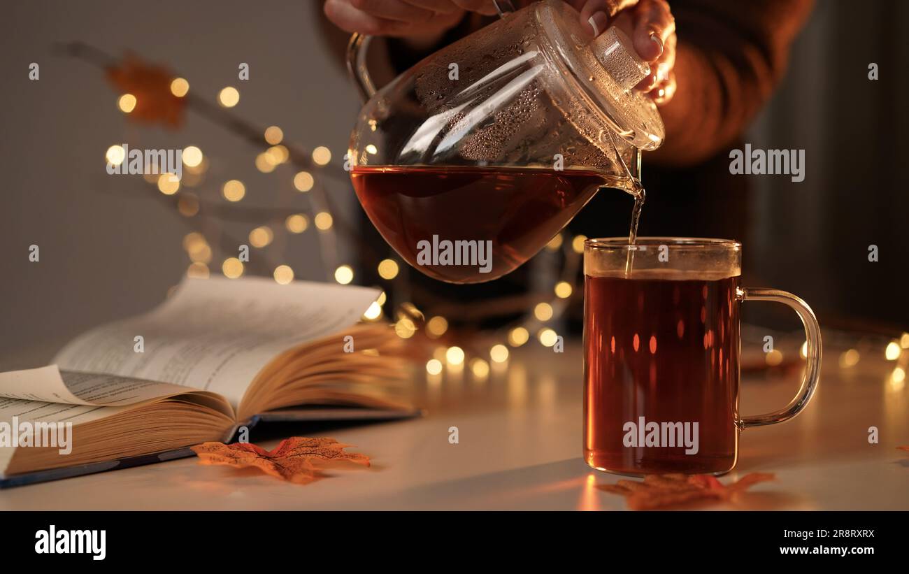 Woman pours tea leaves glass hi-res stock photography and images - Alamy