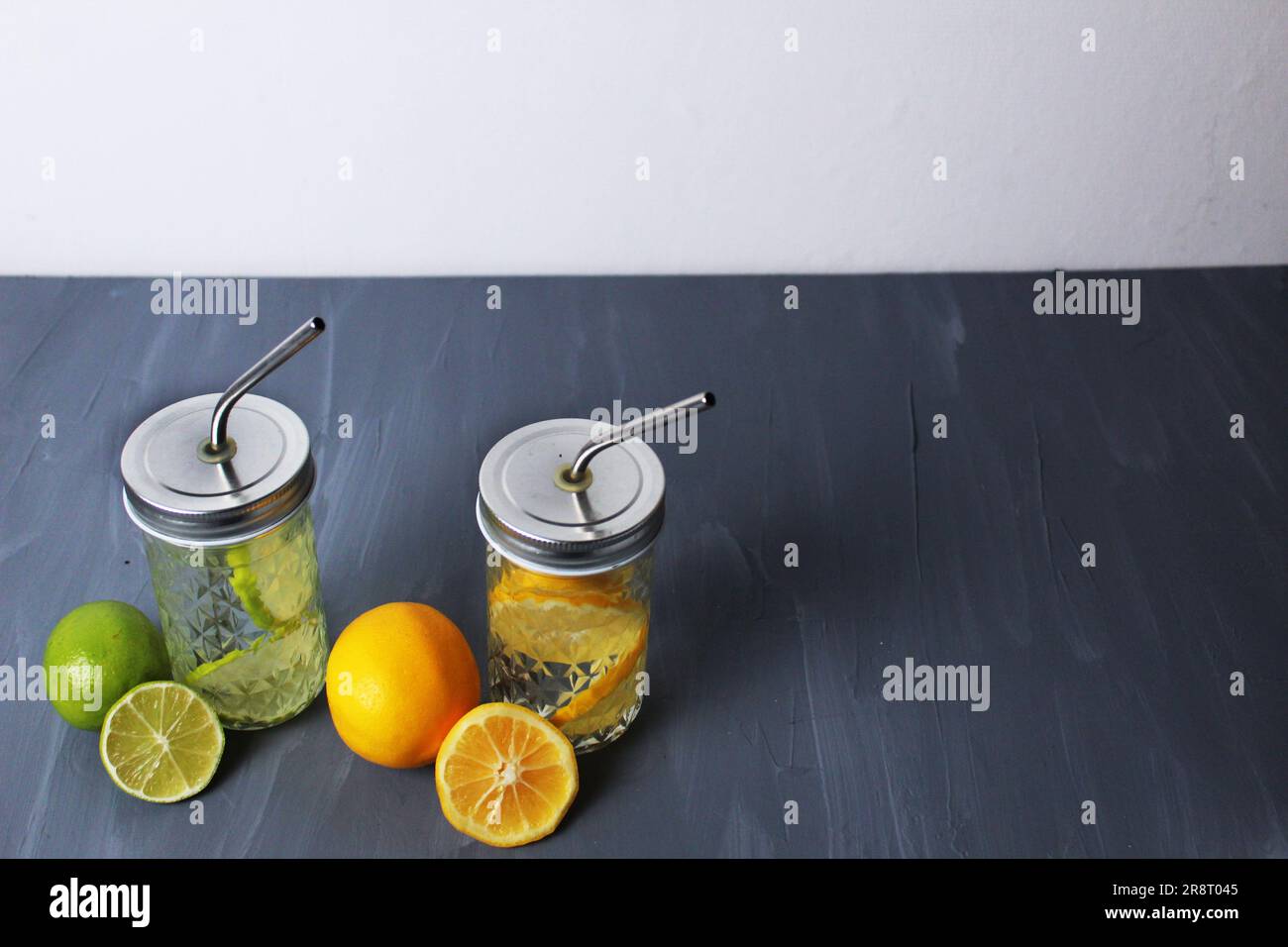 lemonade made from citrus fruits, orange and lime in glasses with a ...