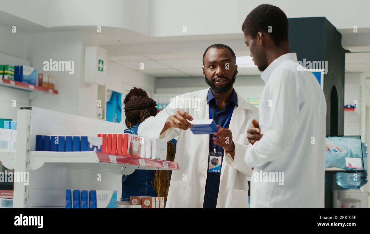 Pharmacist talking to patients hi-res stock photography and images - Alamy