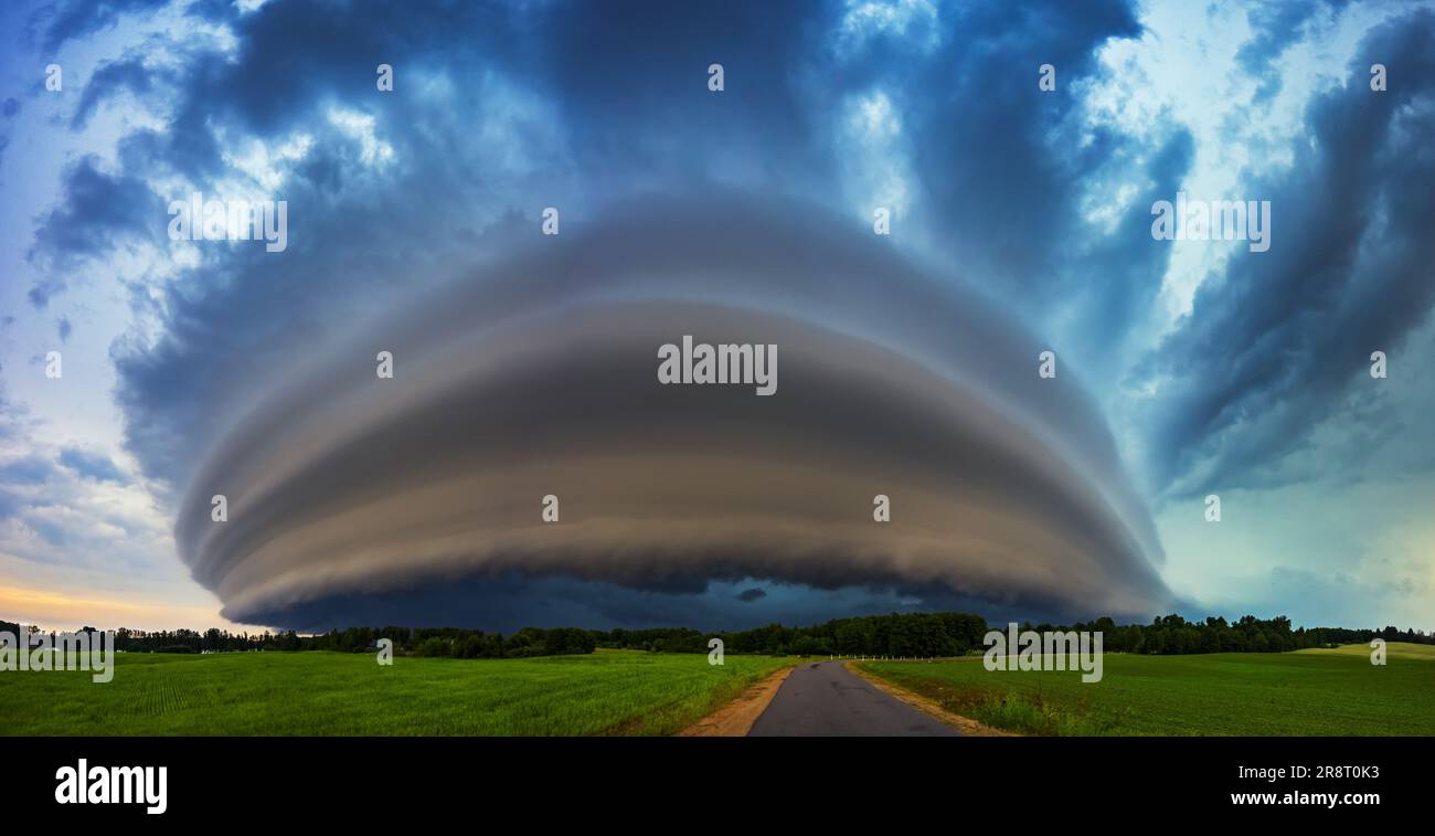 Angry supercell storm influenced by Climate change. Dangerous storm supercell shelf cloud with ...