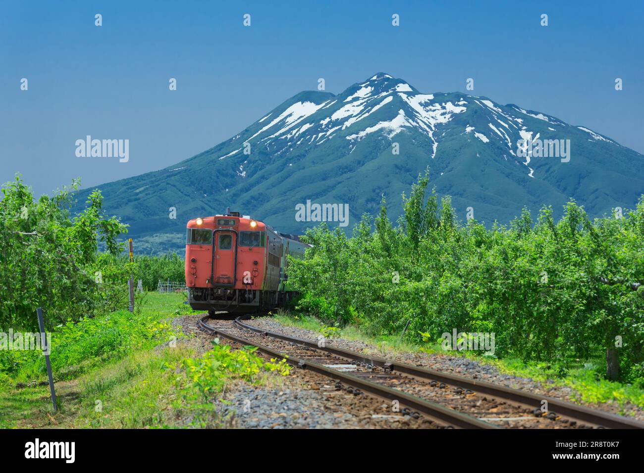 Mount Iwaki in fresh green and the Gono Line Stock Photo - Alamy
