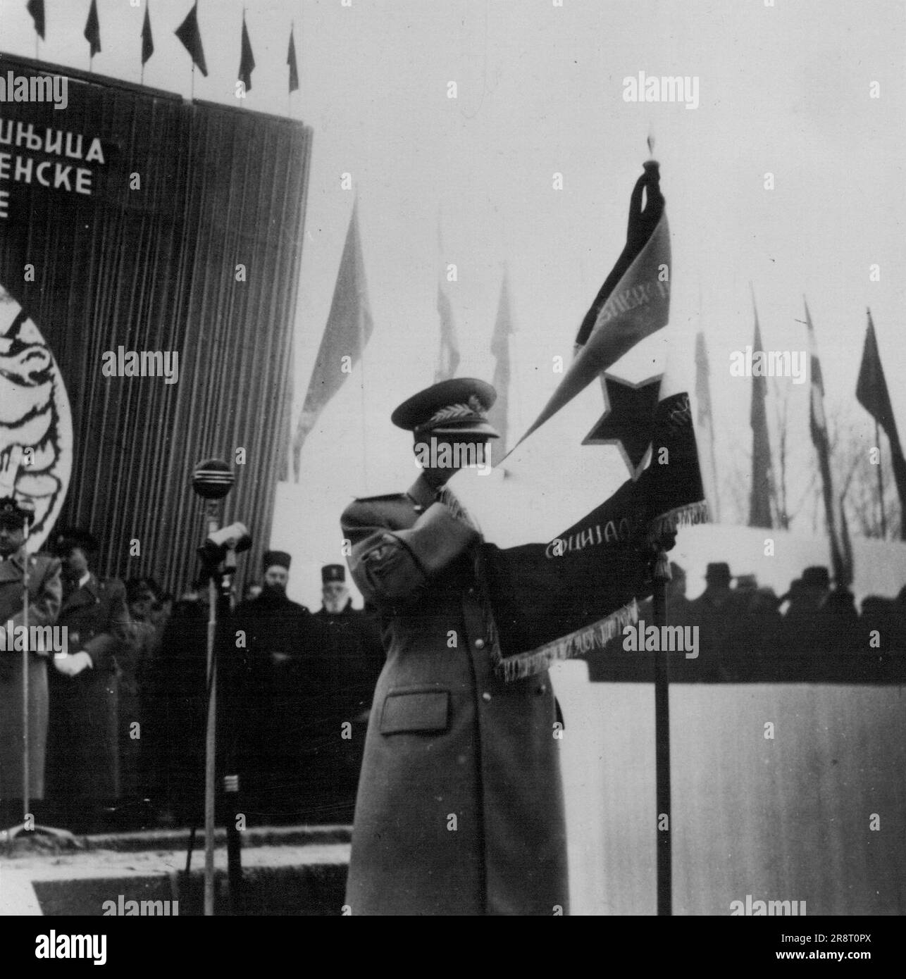 Tito Kisses The Flag -- At a ceremony to mark the tenth anniversary of ...
