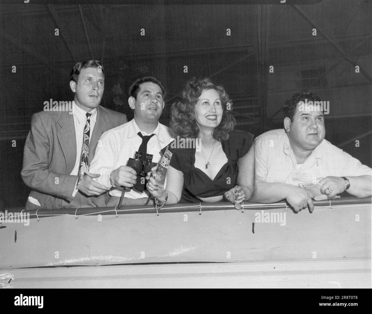 Left to right: Lawrence Tierney, Morrie King, May Mann, film magazine ...