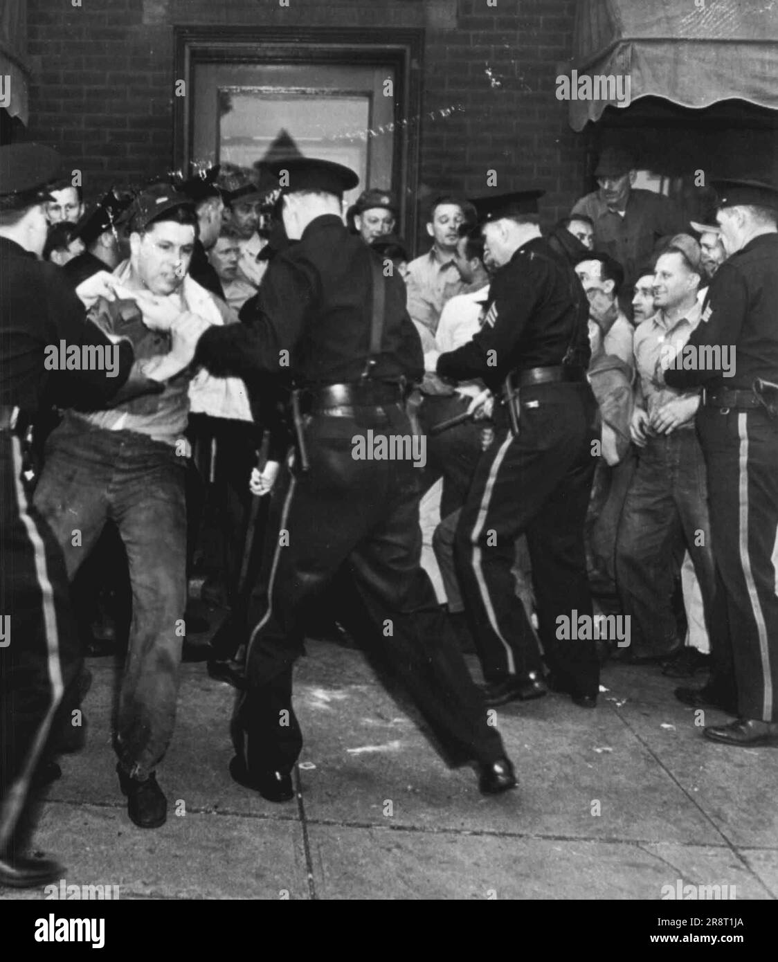 Scuffle: Police scuffle with pickets before offices of the American ...