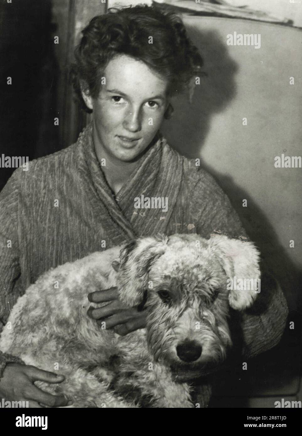 Jacqueline King, 14, cuddles her dog today. ***** played with the dog ...