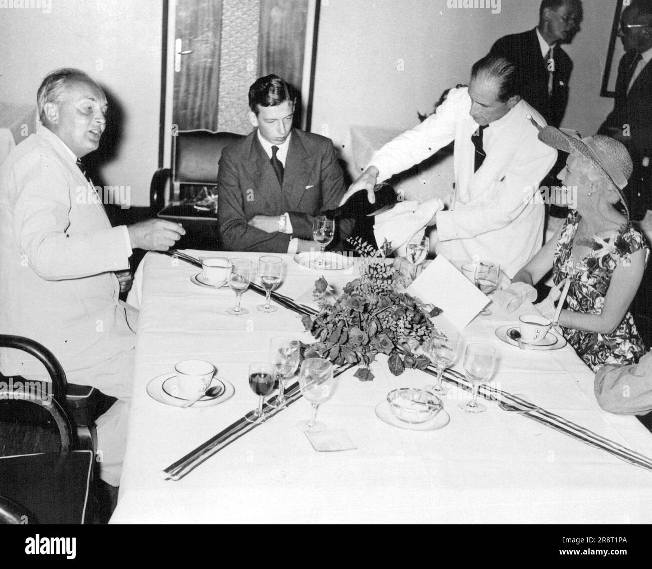 The Duke of Kent, arms folded and a serious expression on his young ...
