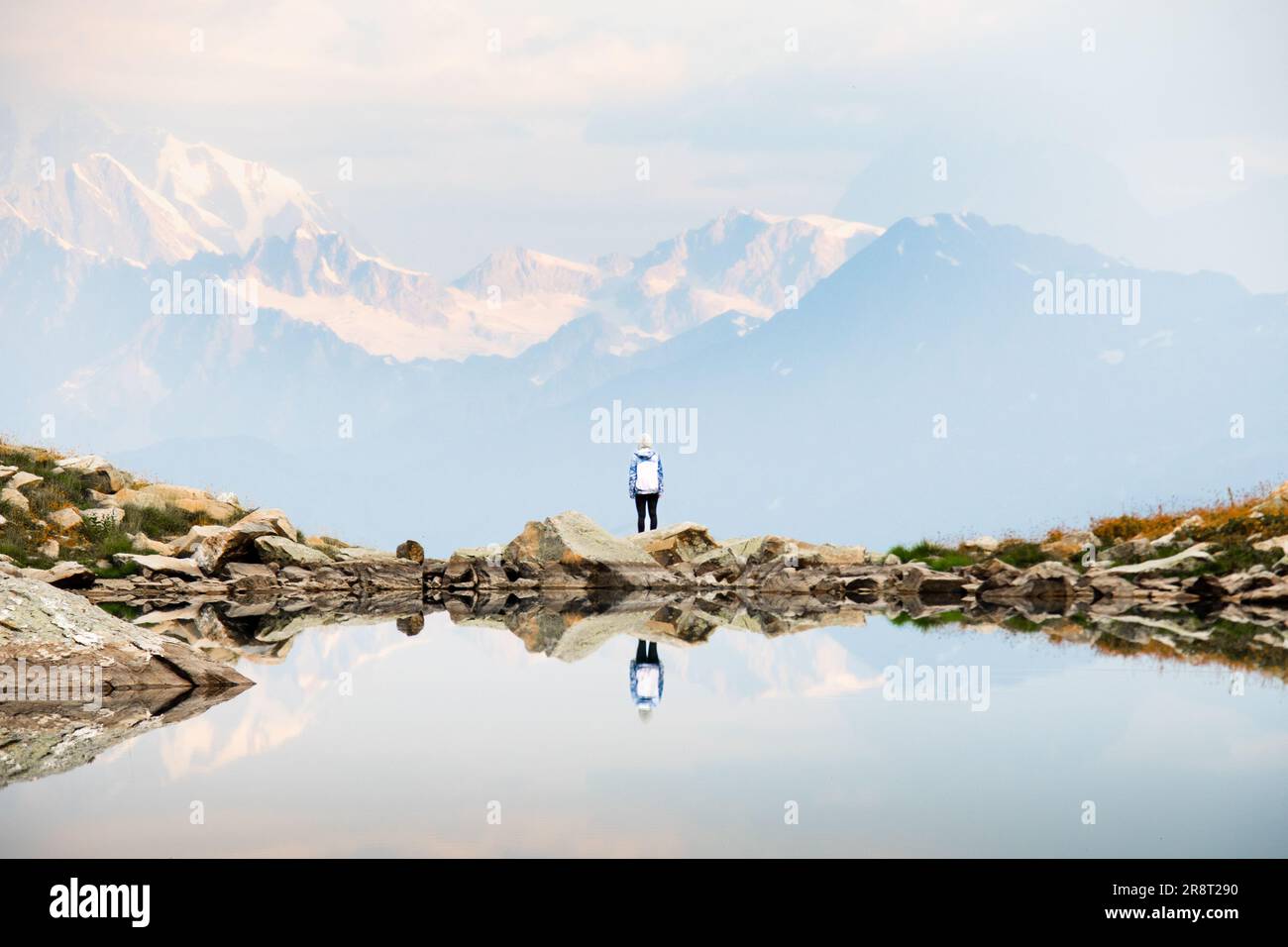 Static view tourist woman stand by Udziro lake viewpoint watch snow ...