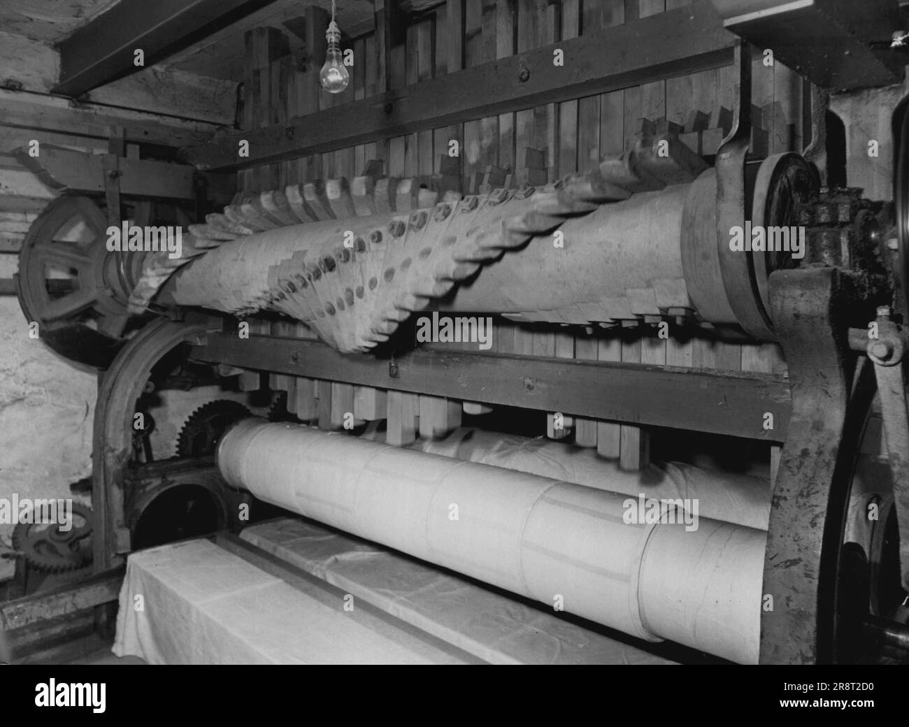 Irish Linen -- Beetling linen. The clothe is wound round the roller and ...