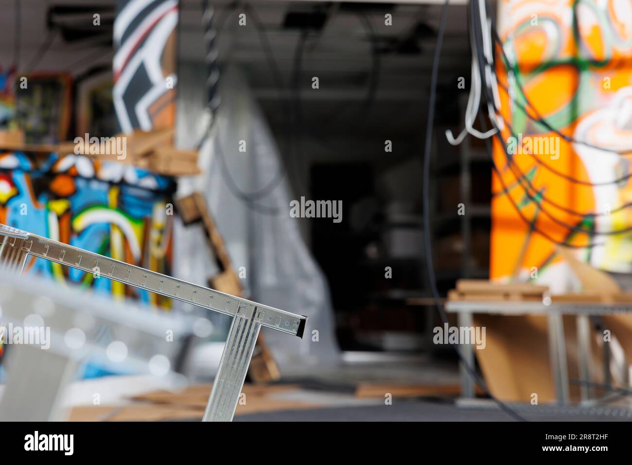 Decaying building structure covered in rusty graffiti art, empty ...
