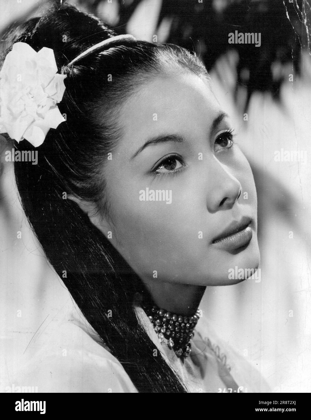 A kiss from actor Gregory Peck 10 years ago is part of the torment of a beautiful Eurasian film ...