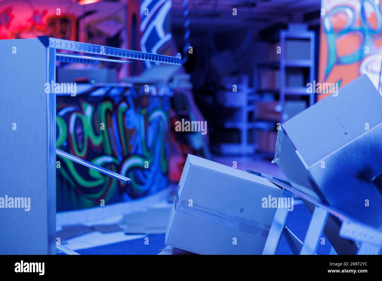 Neglected deserted building with bright neon lights in state of ...