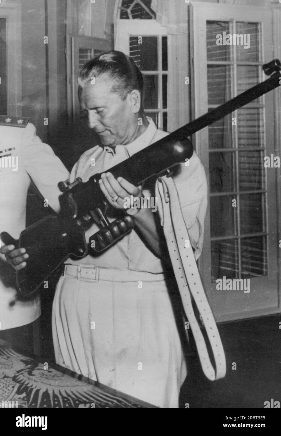 Gunning For Someone......? -- Yugoslav dictator Tito fondly inspects a ...