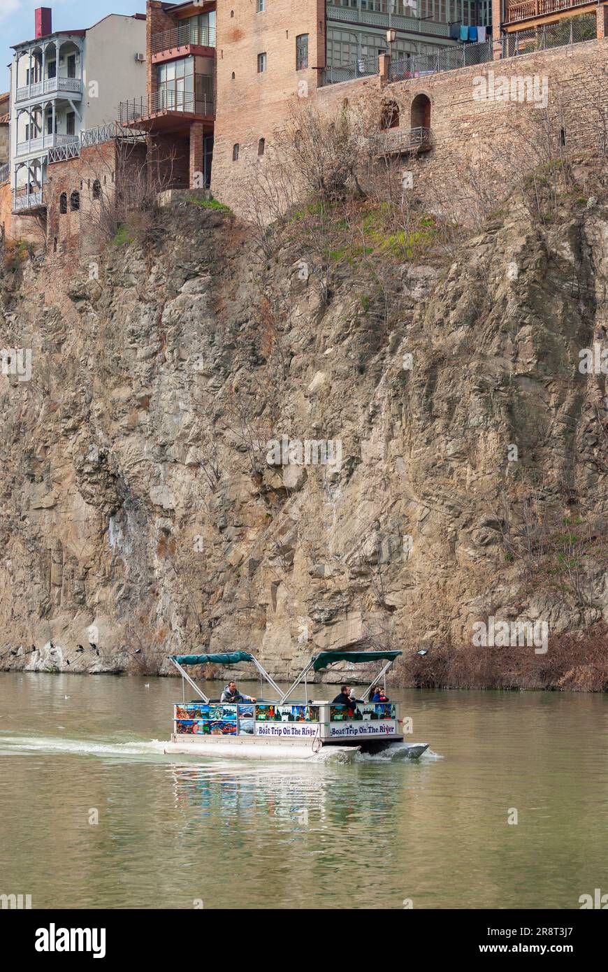 Georgia, Tbilisi - March 17, 2021: Tourists ride on a pleasure boat ...