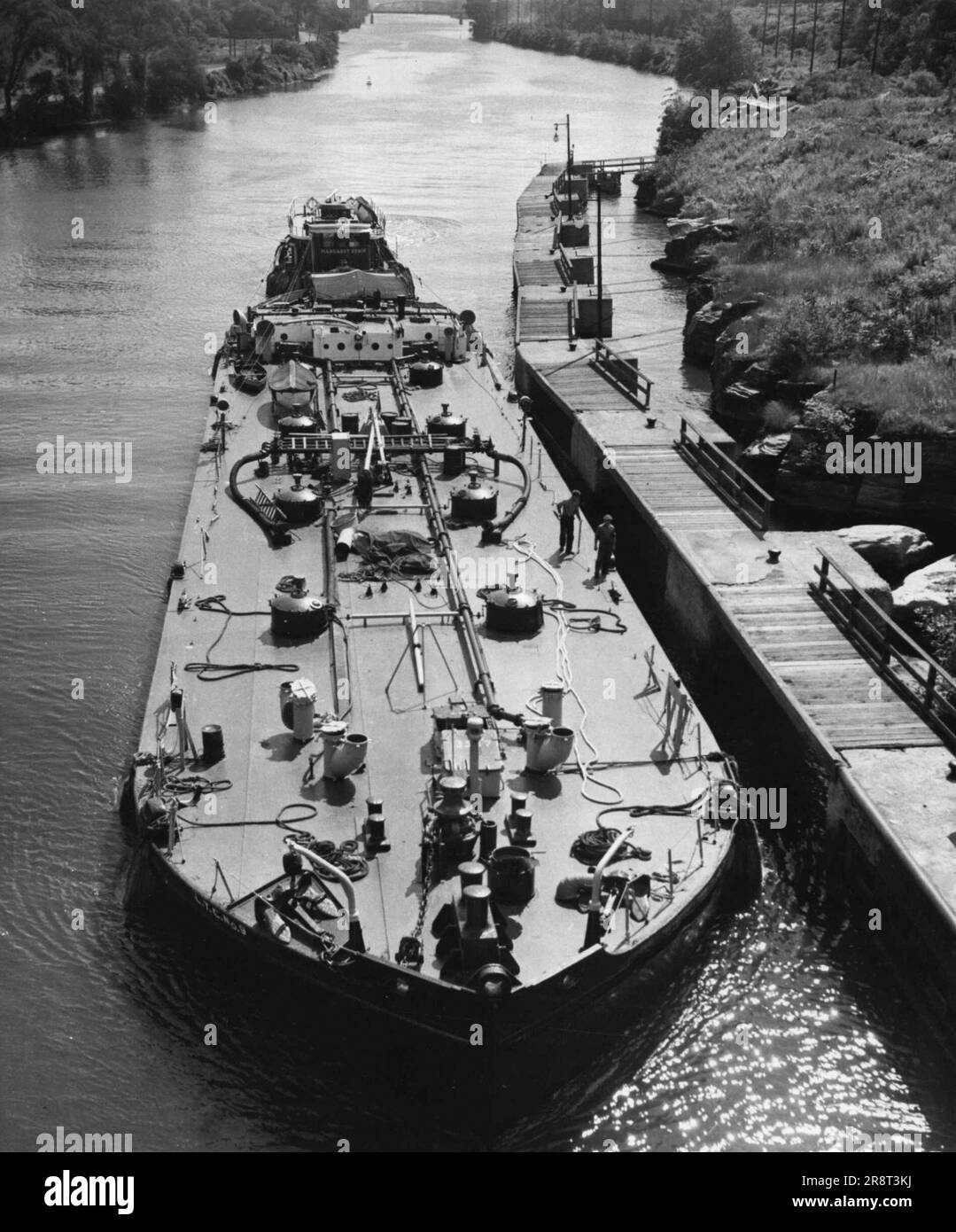 Canal Trip -- A typical oil barge, above, can transport from 13,000 to ...