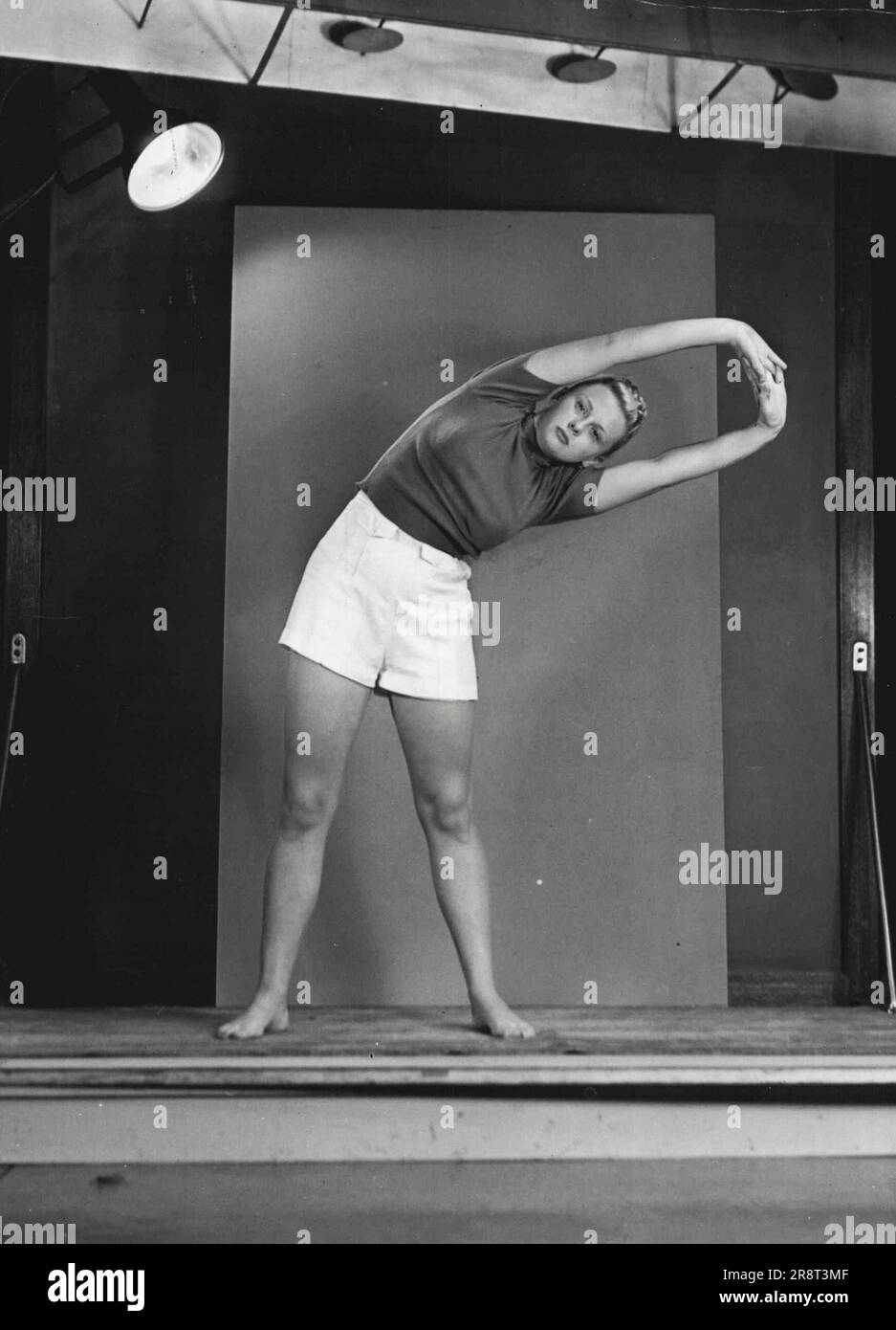 Feet astride, body erect, hands locked overhead. Retract abdomen ...