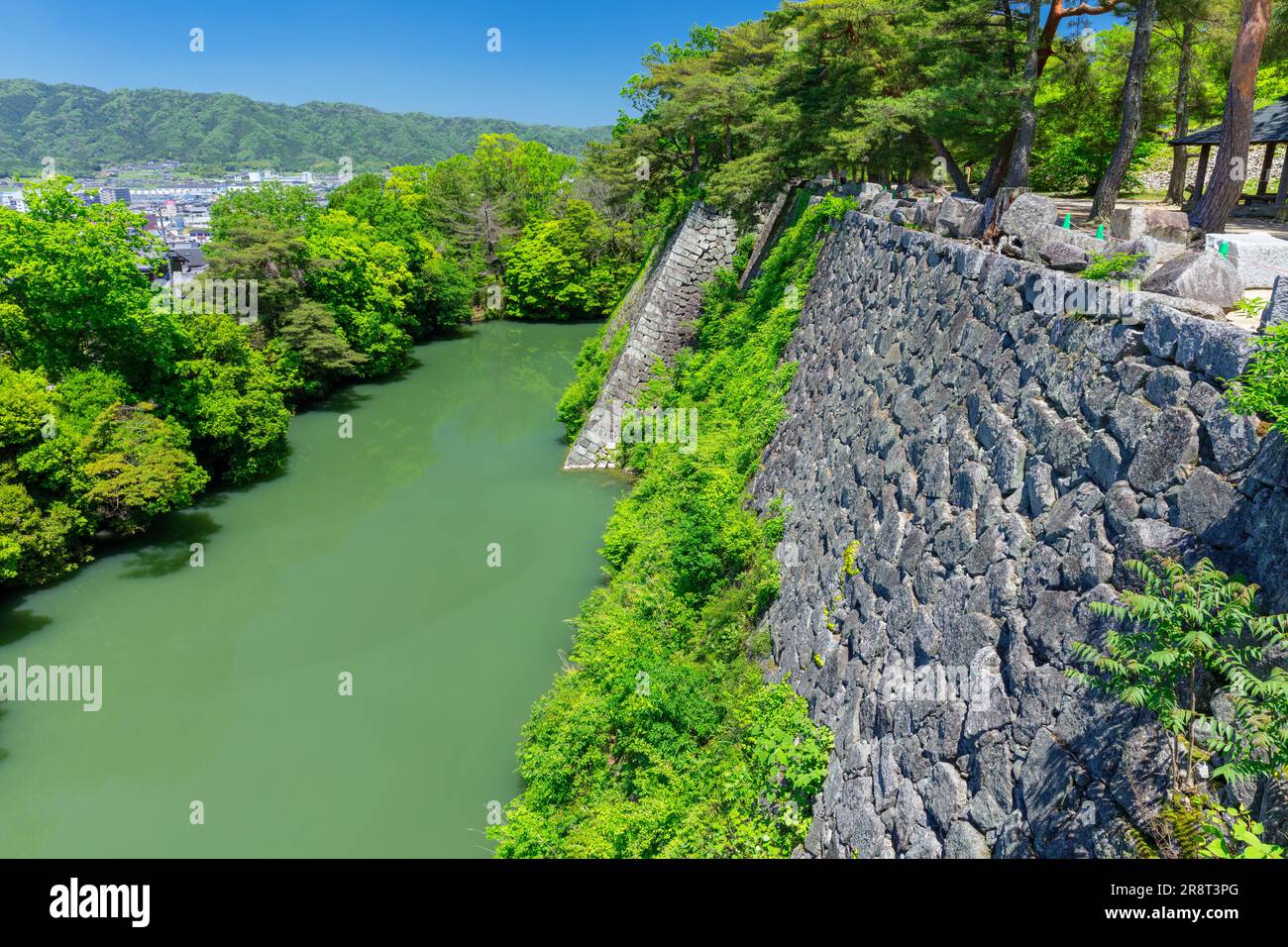 High stonewalls and inner moat of Iga-Ueno Castle in fresh green Stock ...