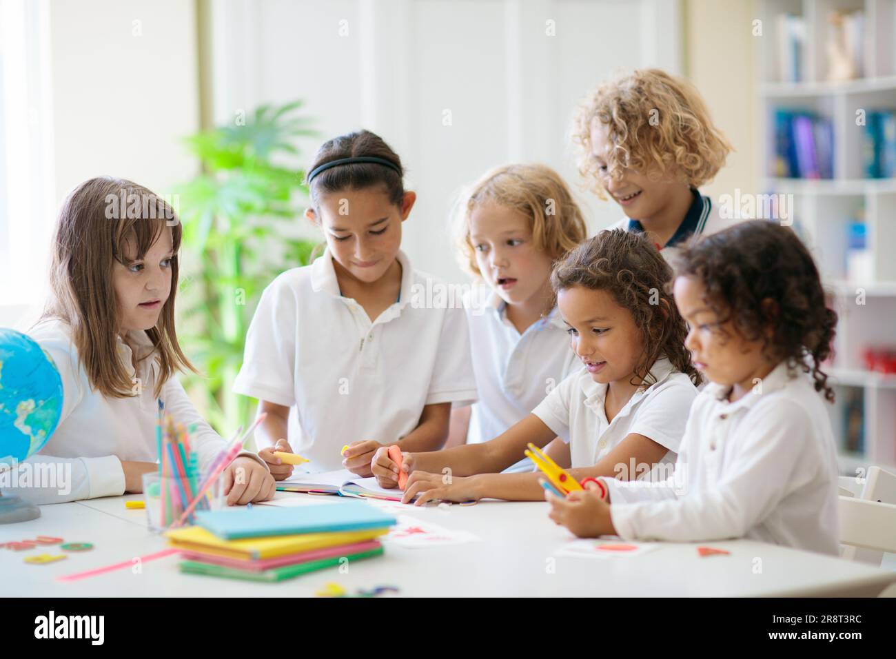 Kids go back to school. Interracial group of children of mixed age in ...