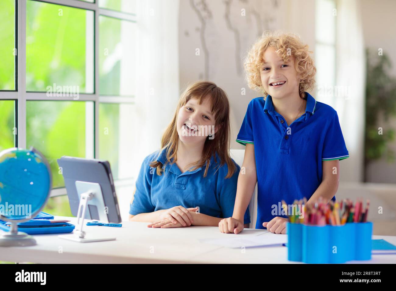 Child doing homework on computer. Online class. Homeschooling and ...