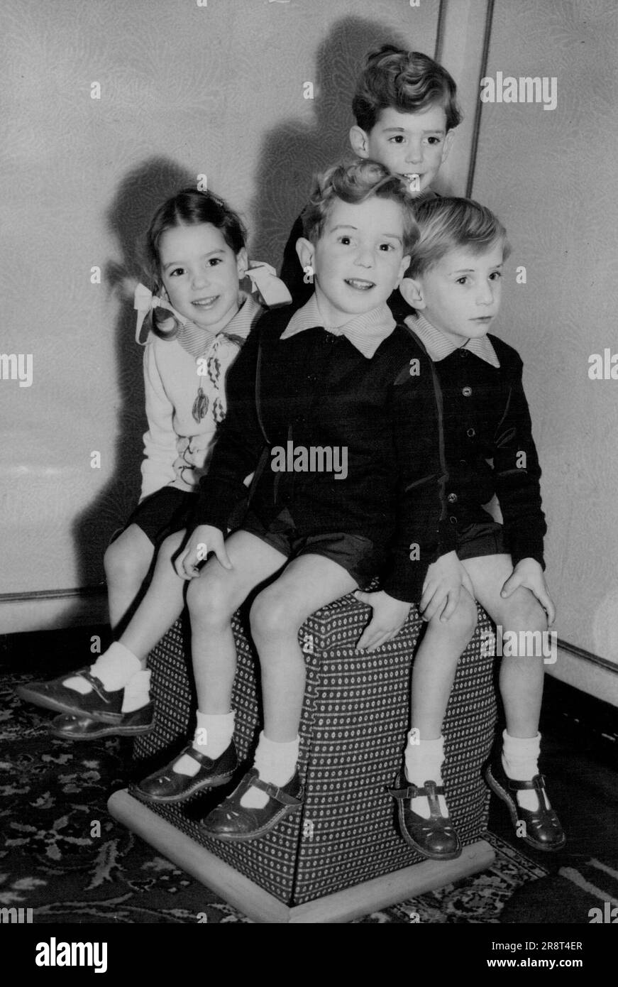 The Taylor Quade, now 4¼, seated on the six-in-one pouffee. In front ...