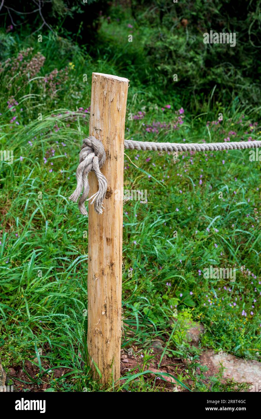 Old rope tied wooden pole hi-res stock photography and images - Alamy