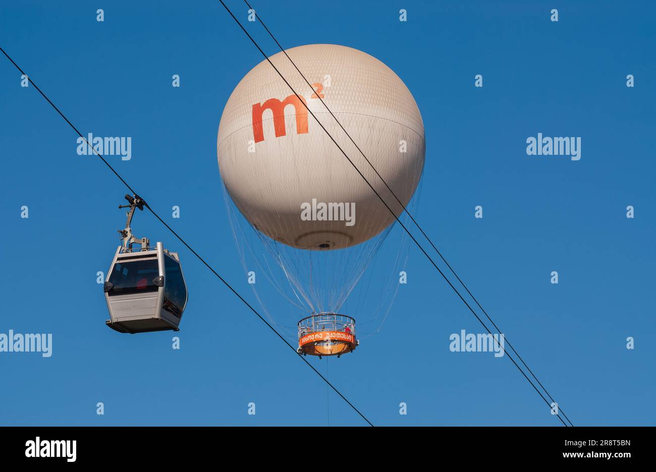Georgia, Tbilisi - October 30, 2022: Air excursion balloon and cable ...