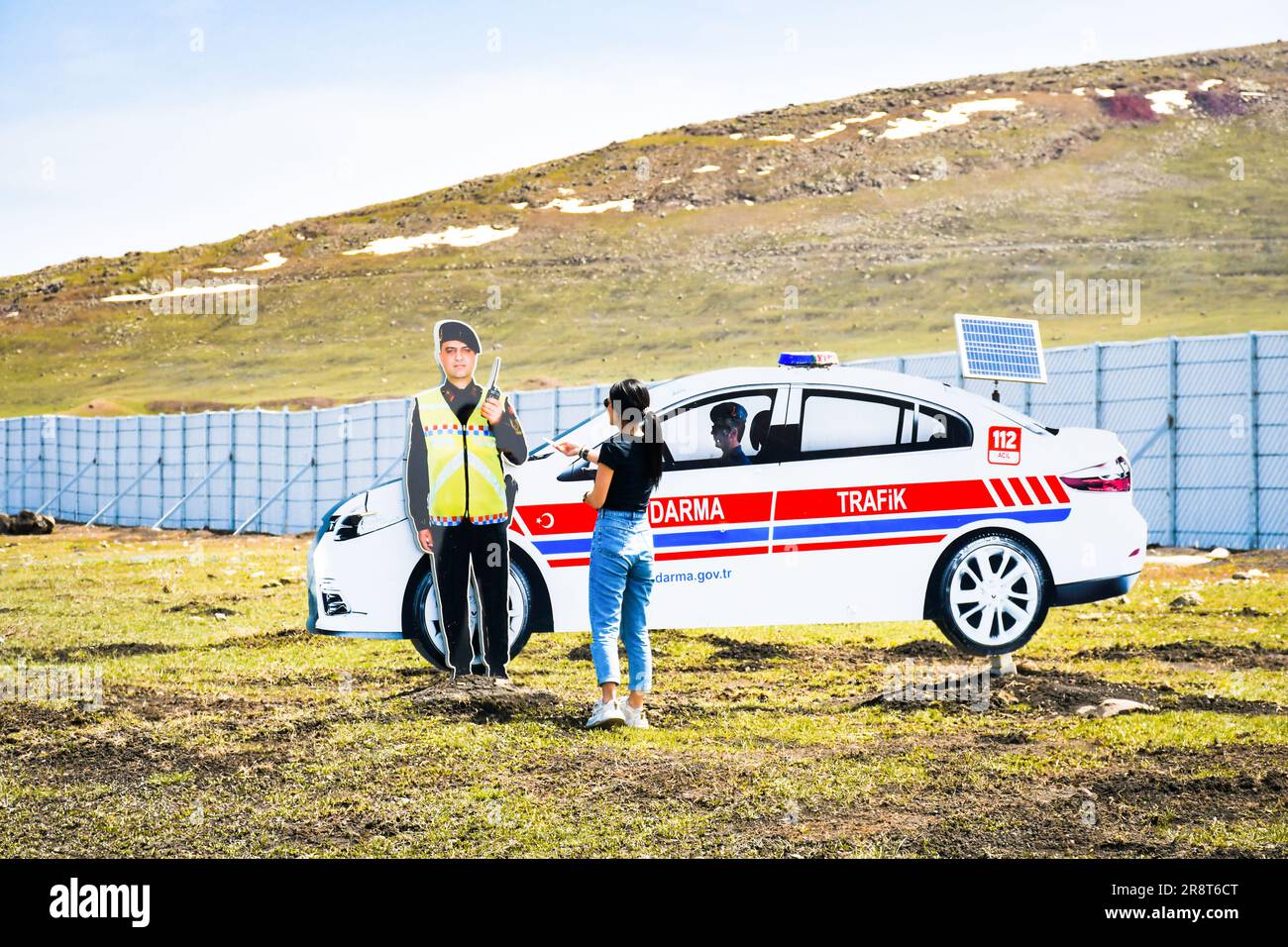 Girl tourist pose show drive license to cardboard police imitation ...