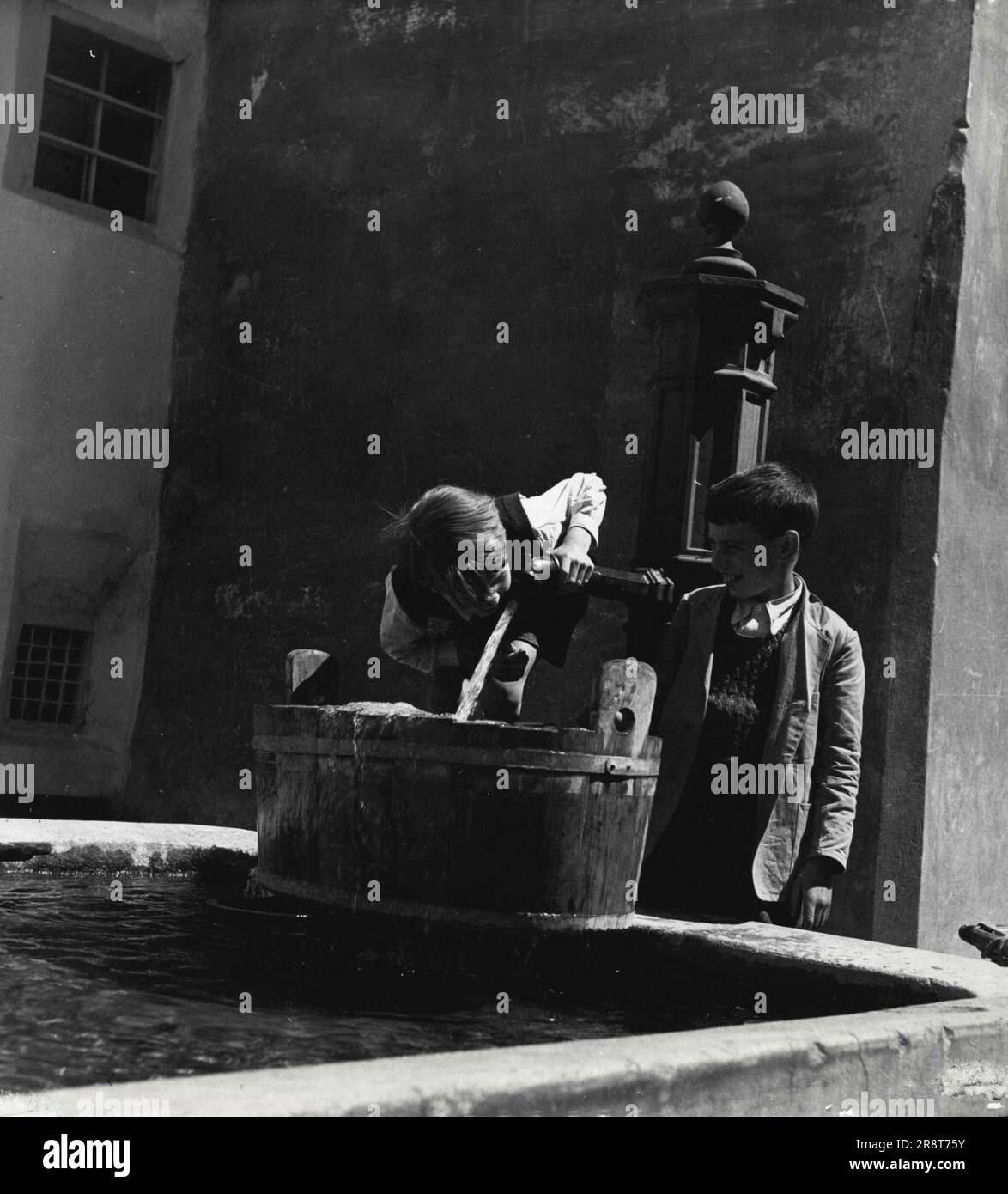 Pontresina -- Life in the High Alps of Switzerland. Boys Drink Clear ...