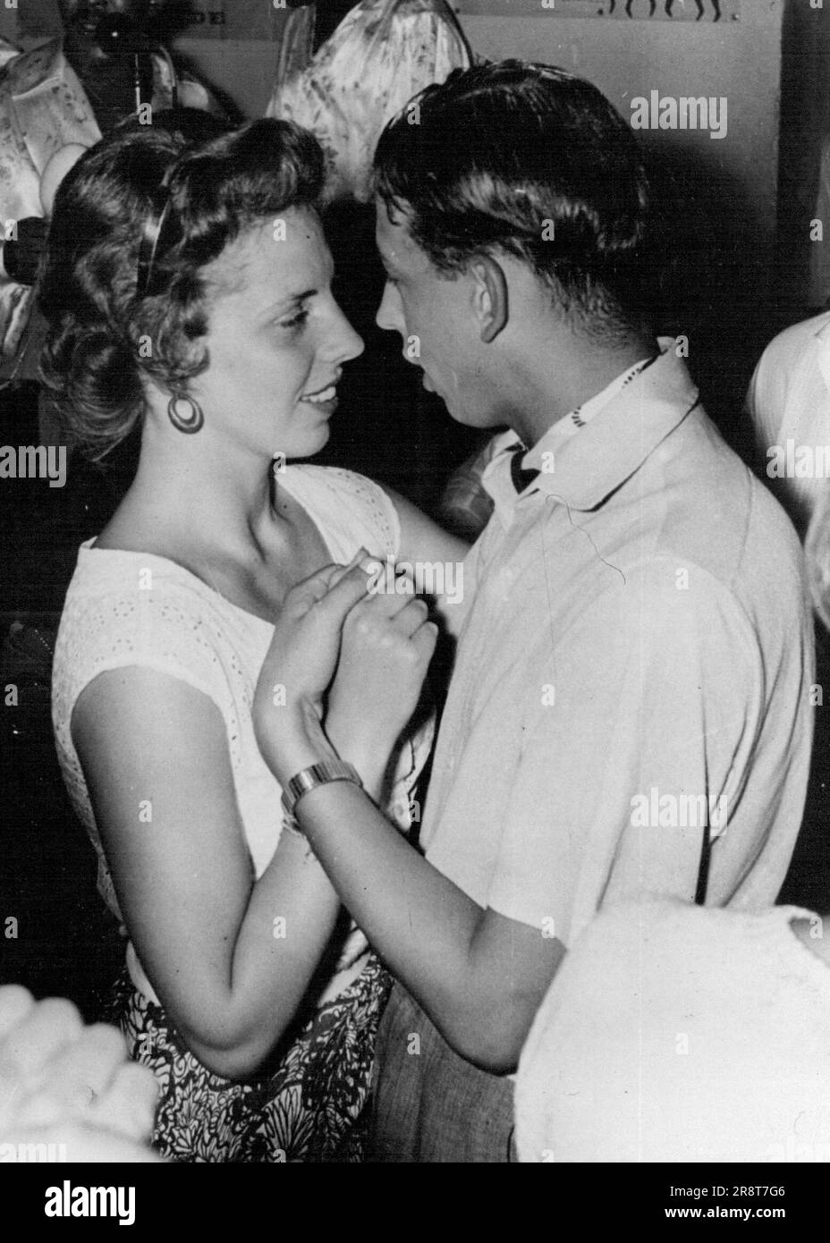 The scene: a night club on the French Riviera. A mambo band plays in ...