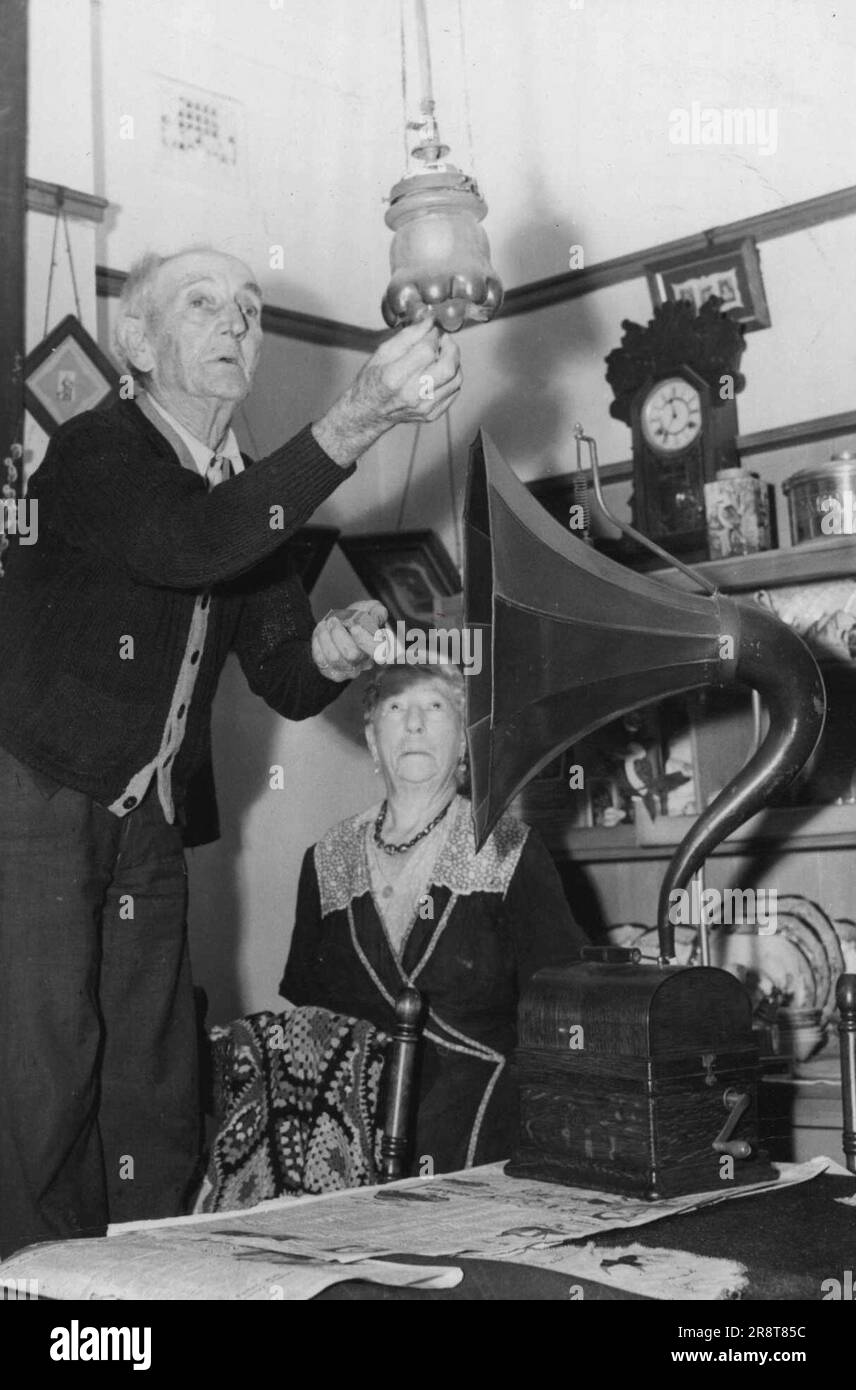 Father lights the gaslight. Mr. and Mrs. John ***** in their old ...