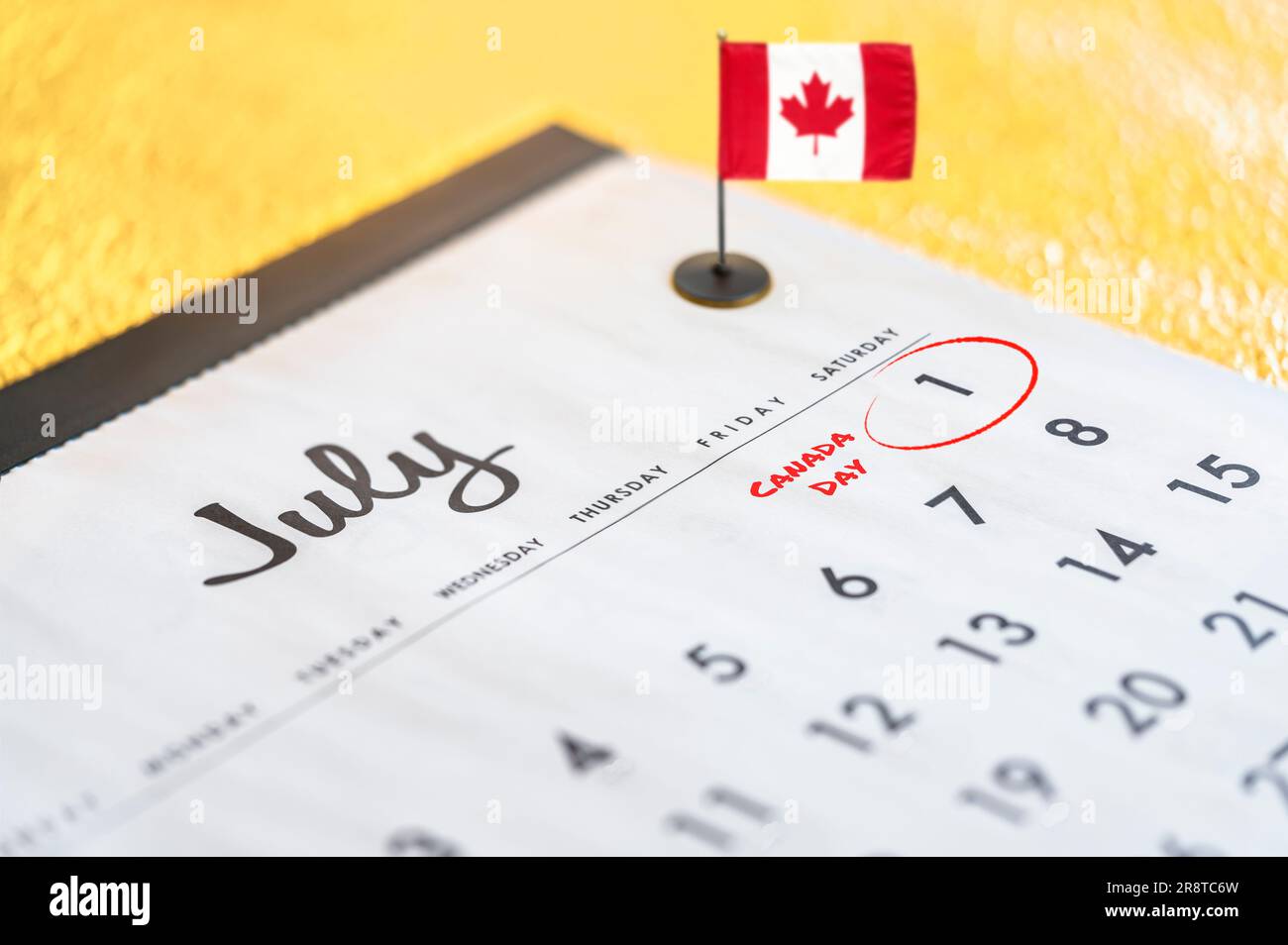 Close-up photograph of a calendar dedicated to the month of July and ...