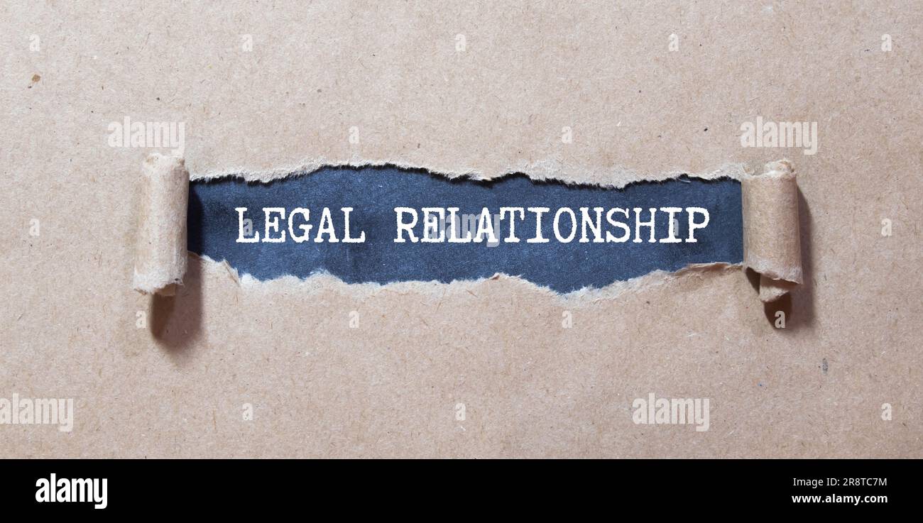 LEGAL RELATIONSHIP concept. Judge's hammer, stationery and magnifying ...