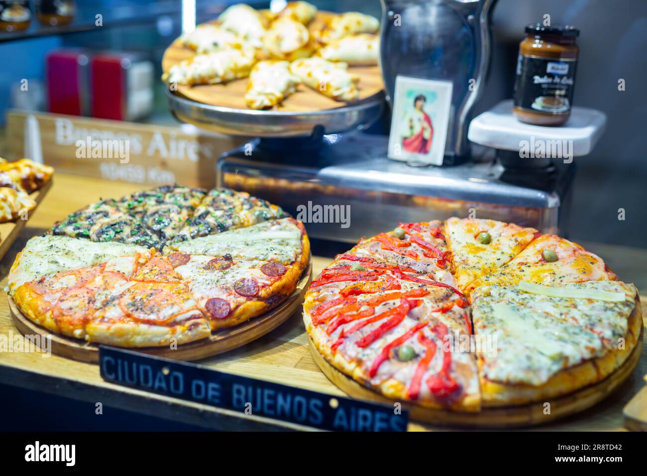 Fresh baked pizza from several slices of different pizza flavors Stock ...