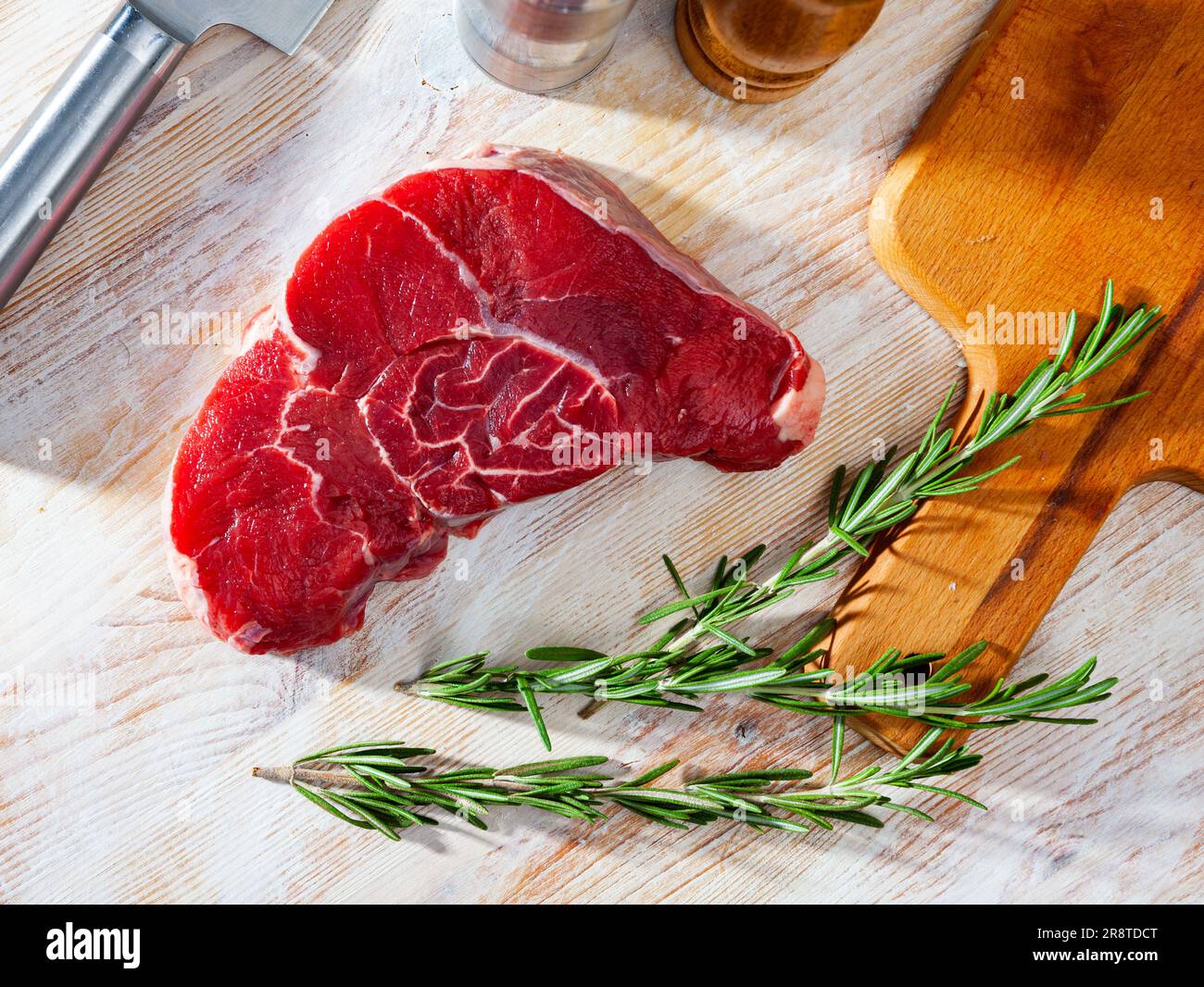 Raw beef fillet with rosemary Stock Photo - Alamy