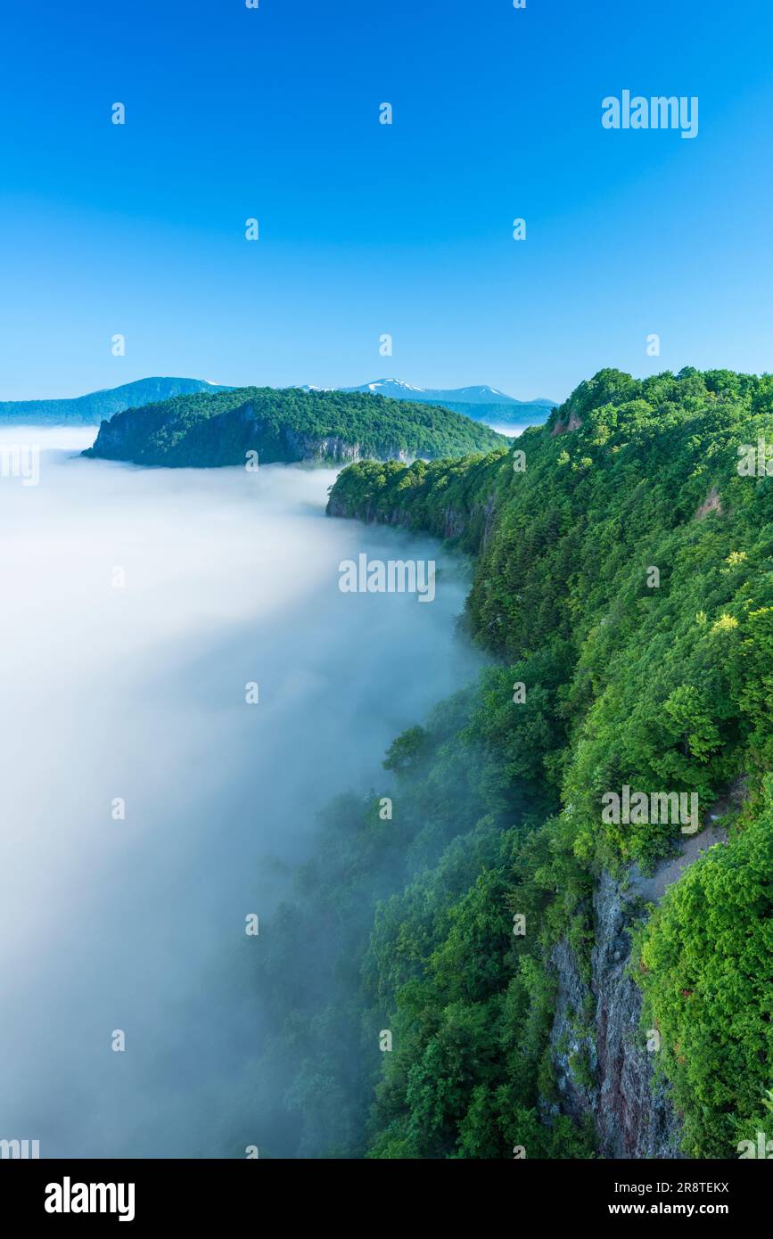 Landscape of Lake Towada wrapped in a sea of clouds Stock Photo - Alamy