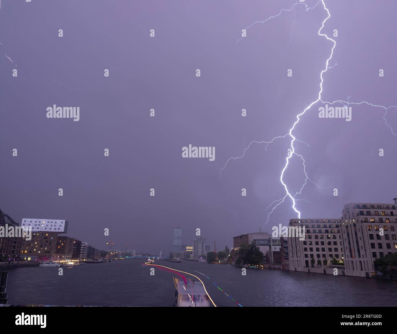 Berlin, Germany. 23rd June, 2023. Lightning discharges in the sky late ...
