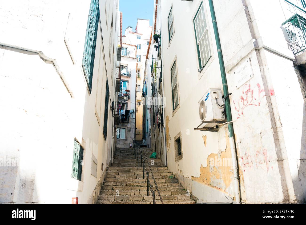 Lisbon, Portugal - February 17, 2023: Back alleyway with long ...